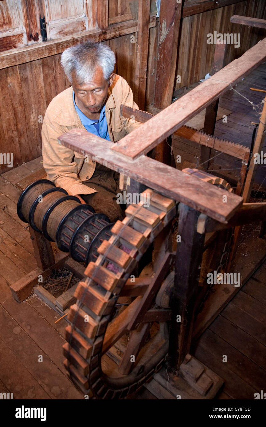 Myanmar, Burma. Burmese Man of Intha Ethnic Group Spinning Fiber from ...