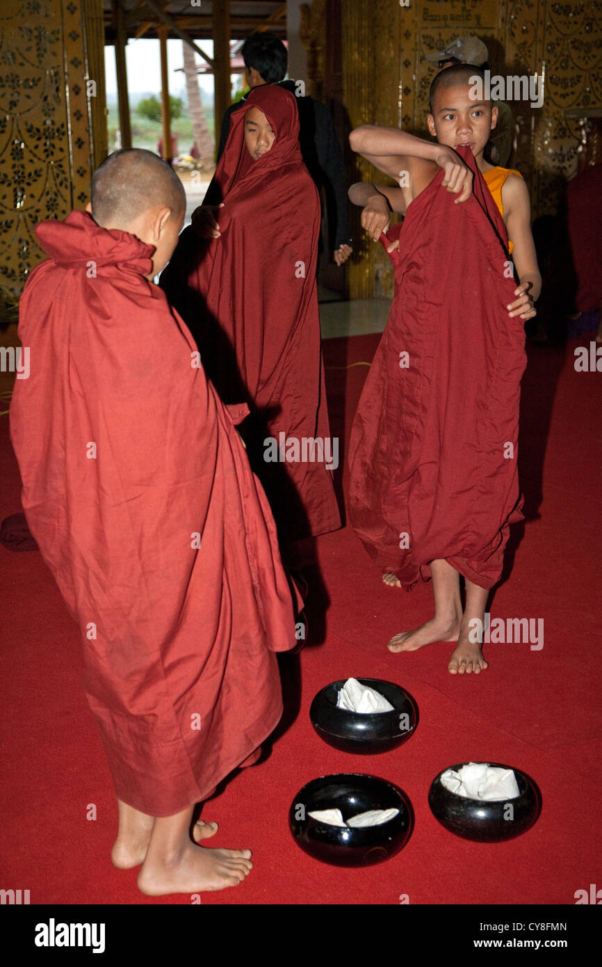 Myanmar, Burma. Young Buddhist Monks Donning Robes for a Ceremony ...