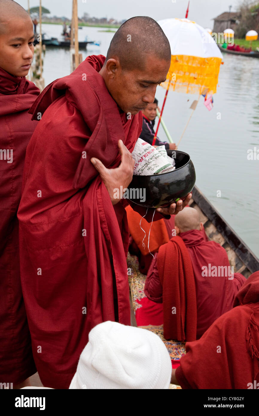 Myanmar, Burma. Monks Getting into Boat to go to Ceremony. Alodaw Pauk ...