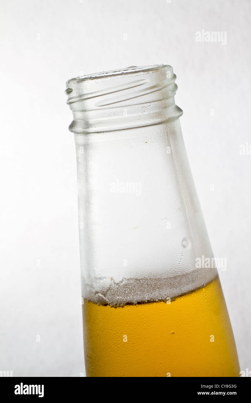 Close up of a clear beer bottle Stock Photo - Alamy