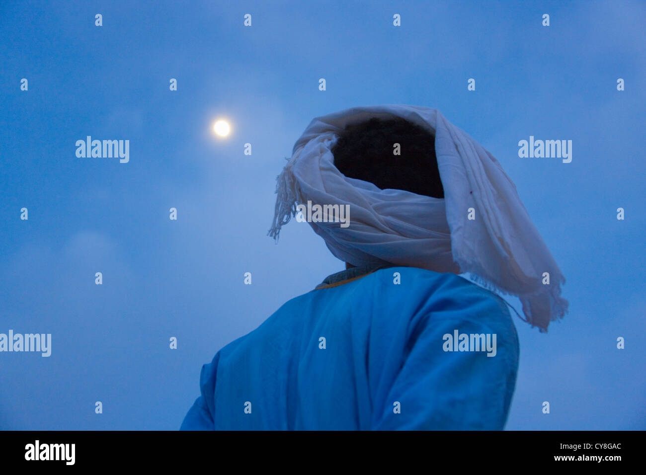 Man watching moon over Sahara Desert, Erg Chebbi, Morocco Stock Photo ...