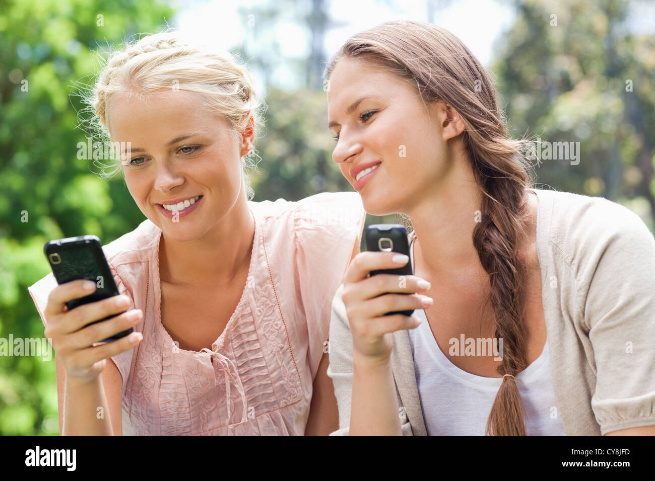 Friends with their cellphones Stock Photo - Alamy