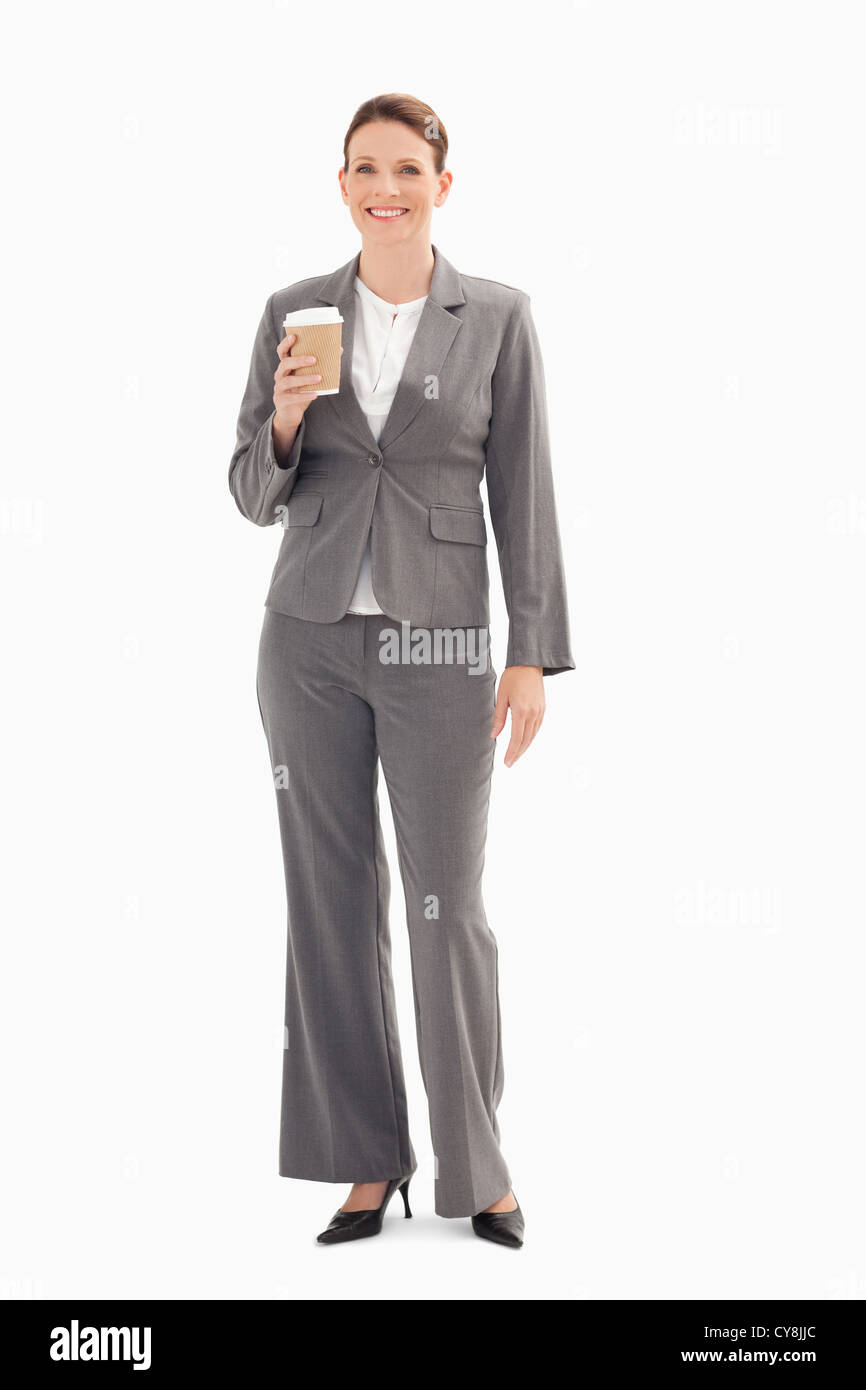 Smiling businesswoman holding cup of coffee Stock Photo - Alamy