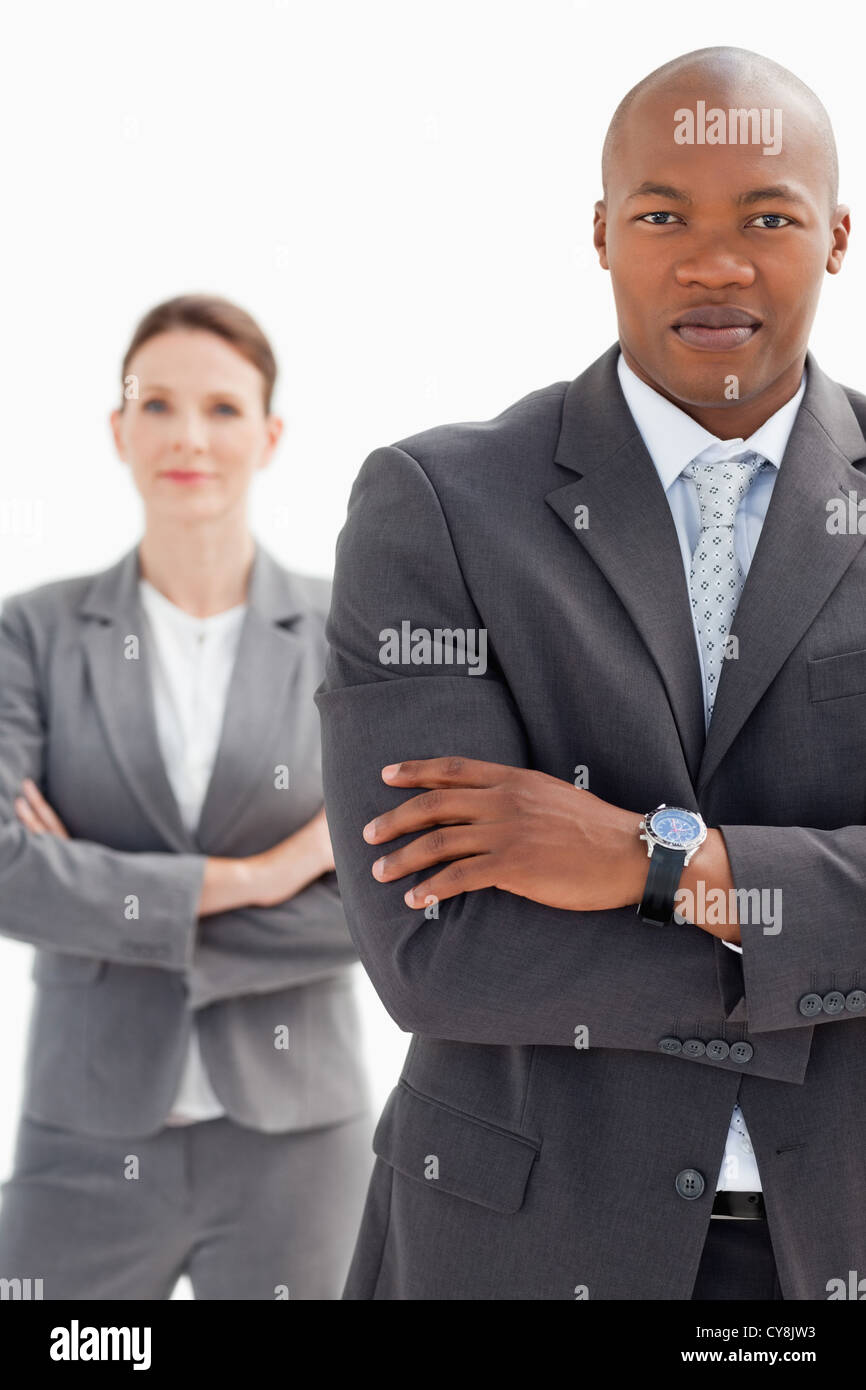 Businesswoman stands behind a businessman Stock Photo - Alamy