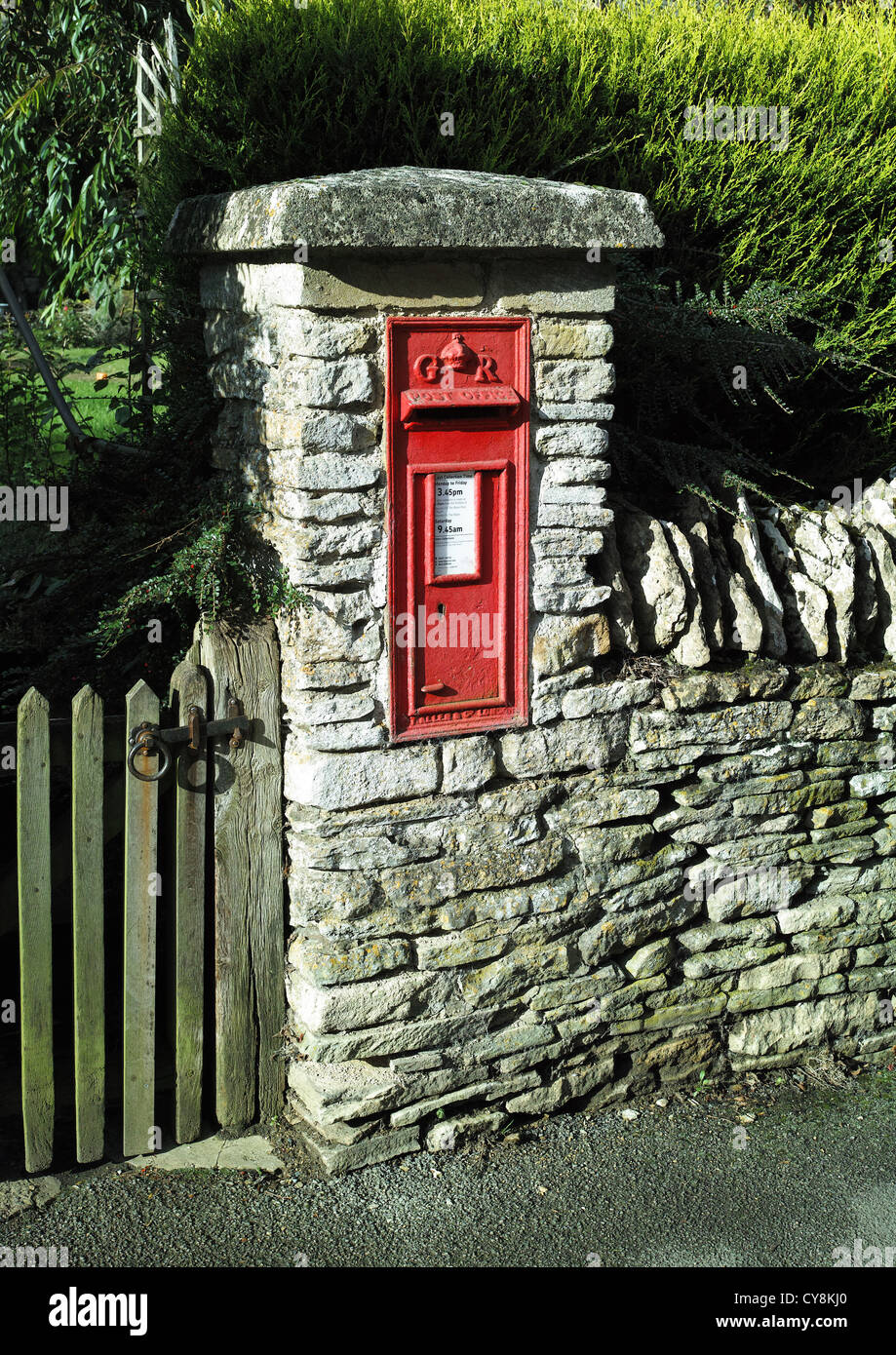 postbox in wall outside house in village Stock Photo - Alamy