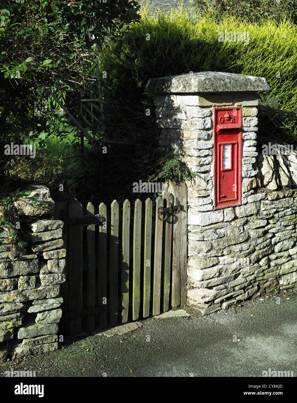 postbox in wall outside house in village Stock Photo - Alamy