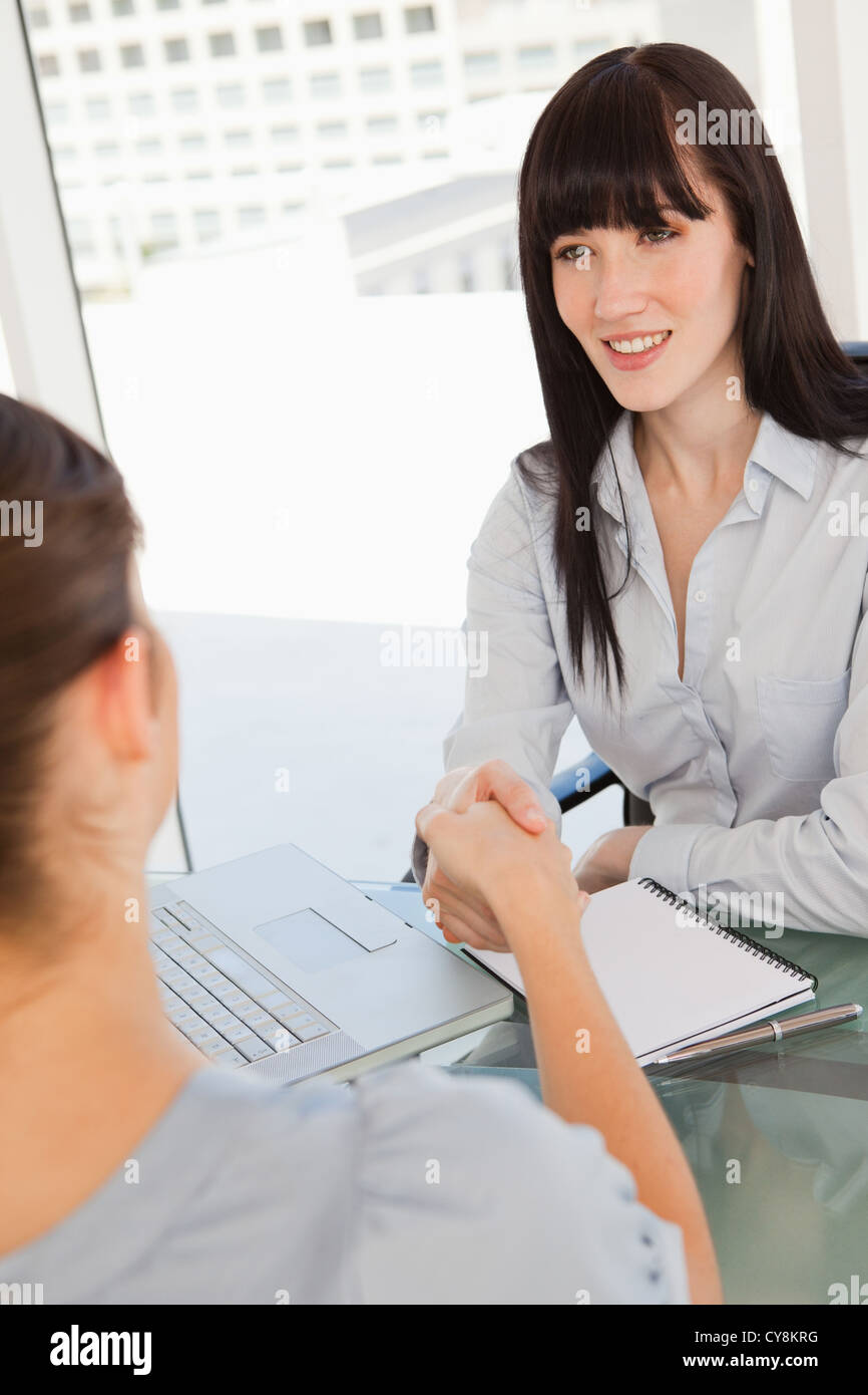 Both women shake hands after a good interview Stock Photo - Alamy