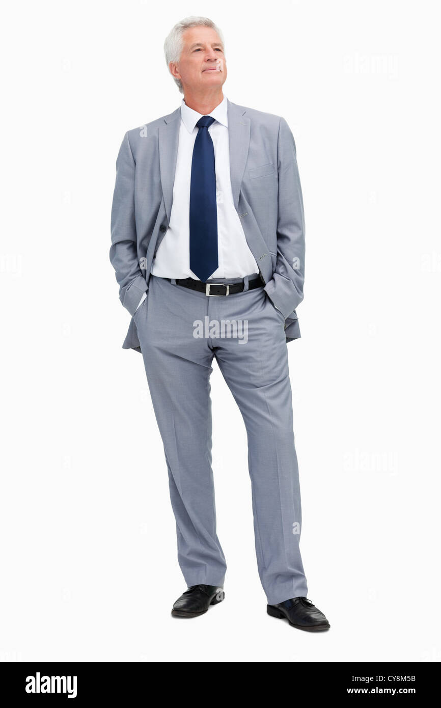Man in a suit with hands in the pockets Stock Photo - Alamy
