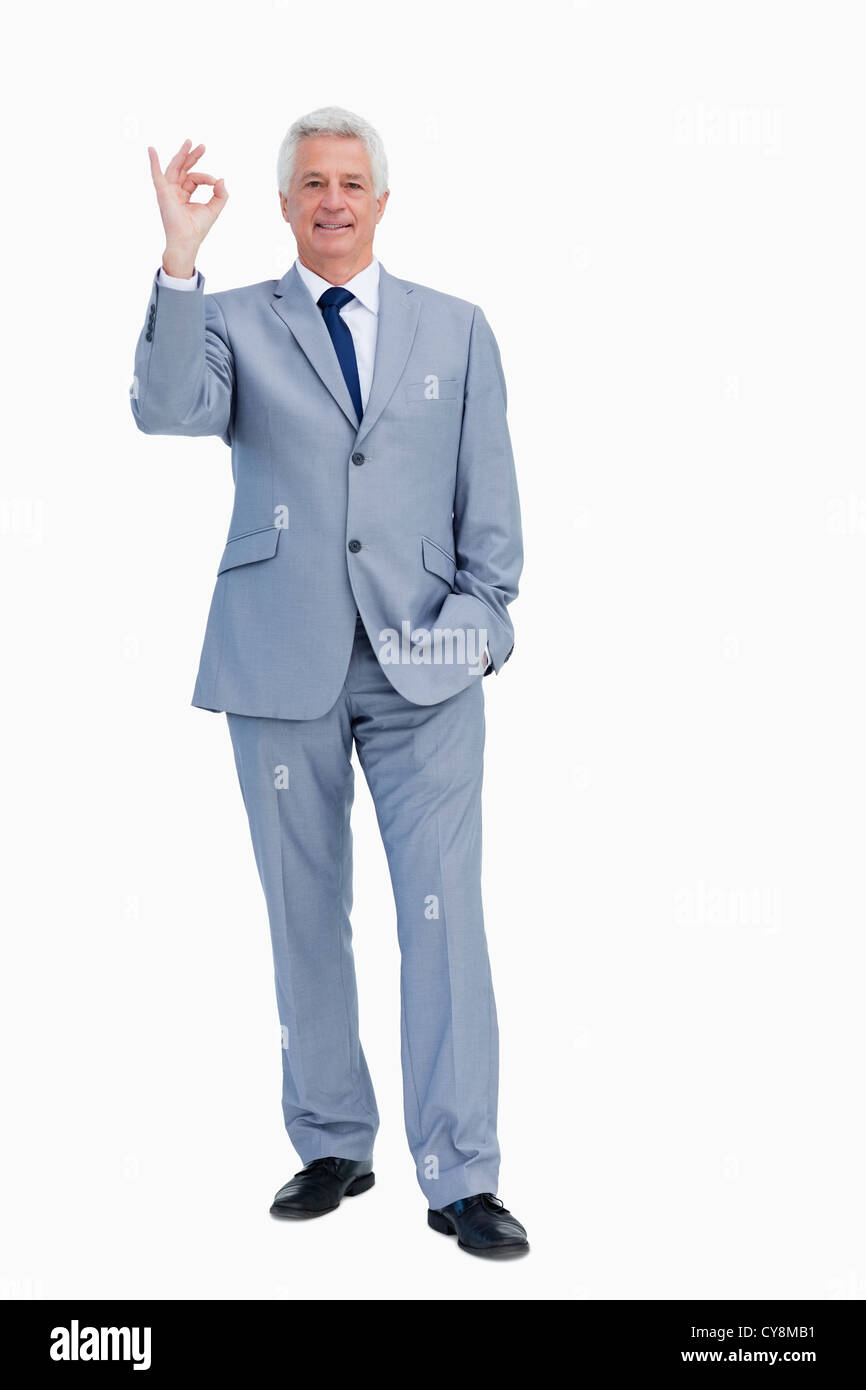 Portrait of a businessman showing the ok sign Stock Photo - Alamy