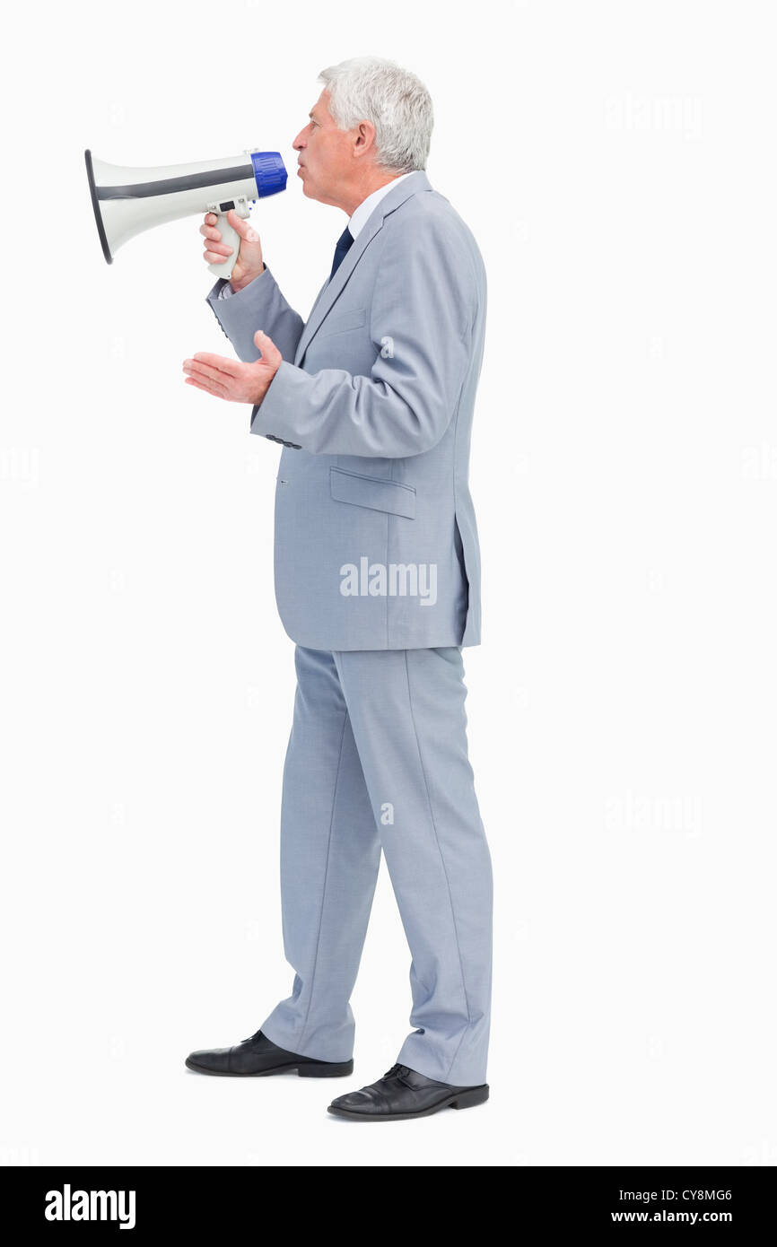Profile of a businessman speaking into a megaphone Stock Photo - Alamy