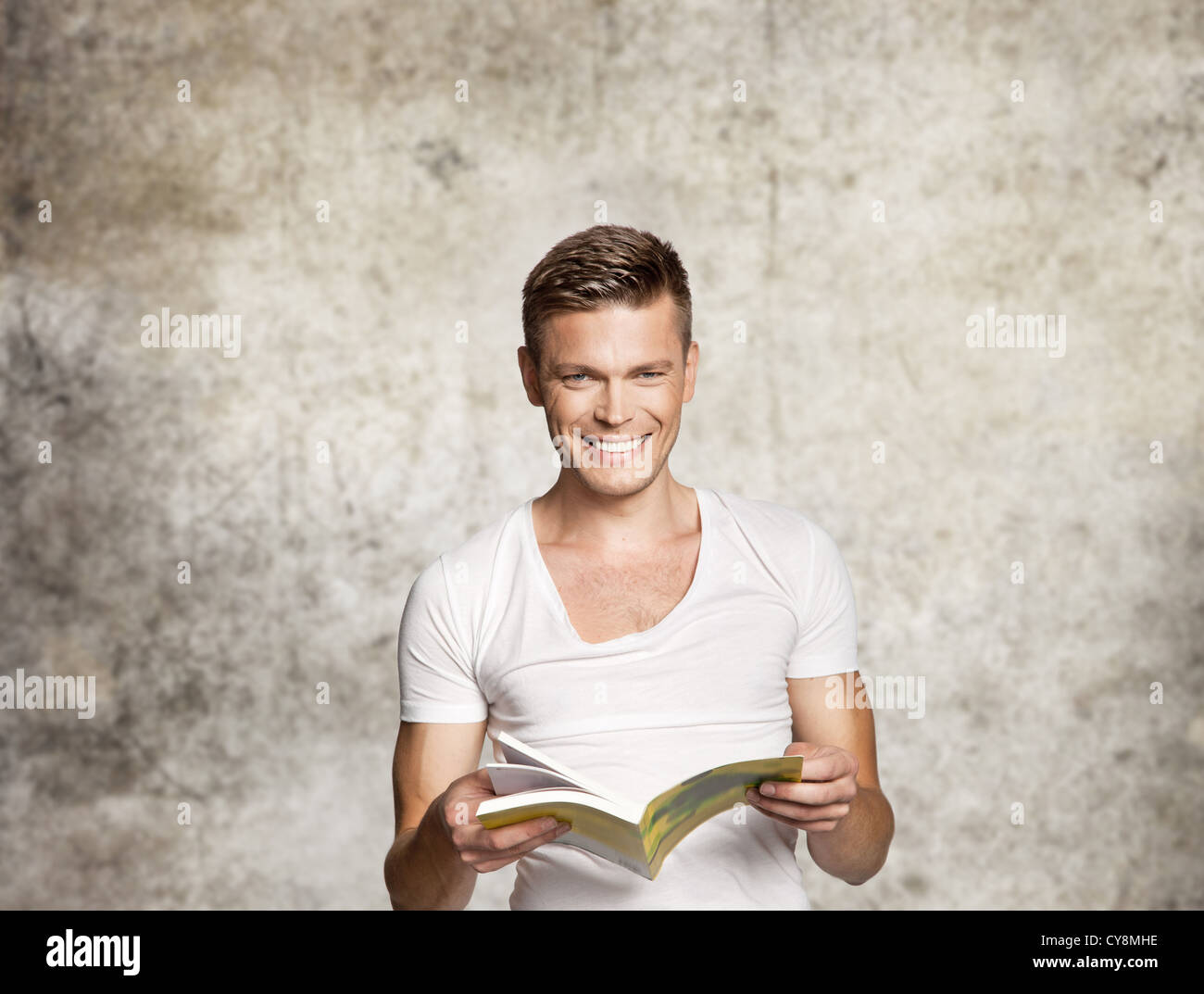 Portrait of a man with a book Stock Photo - Alamy