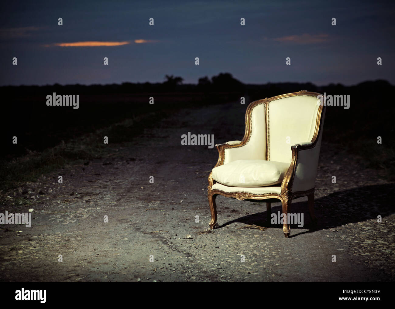 antique chair let on the road Stock Photo - Alamy