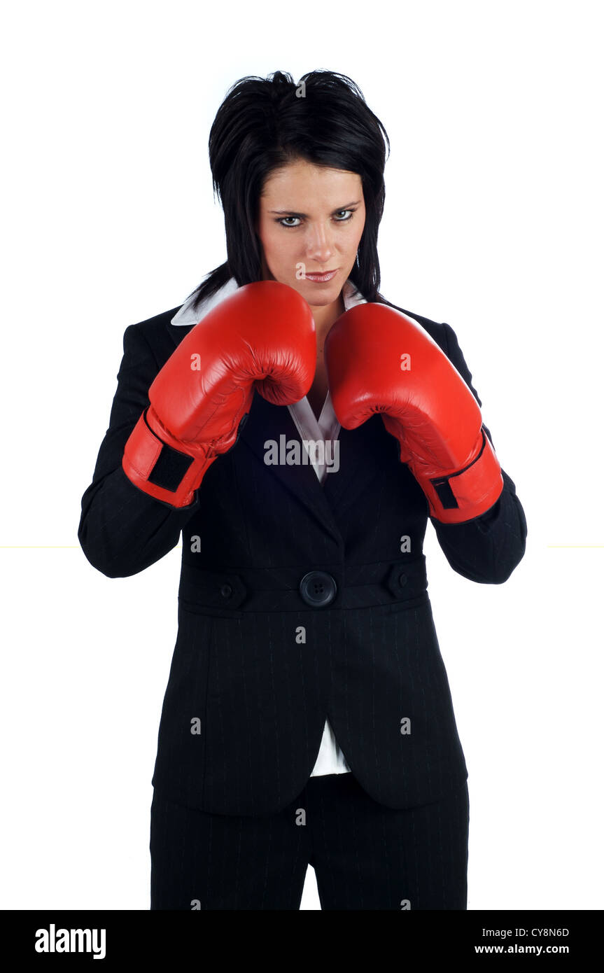 Business woman wearing red boxing gloves isolated on a white background ...