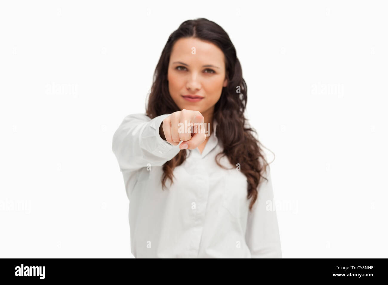 Portrait of a brunette woman pointing Stock Photo - Alamy