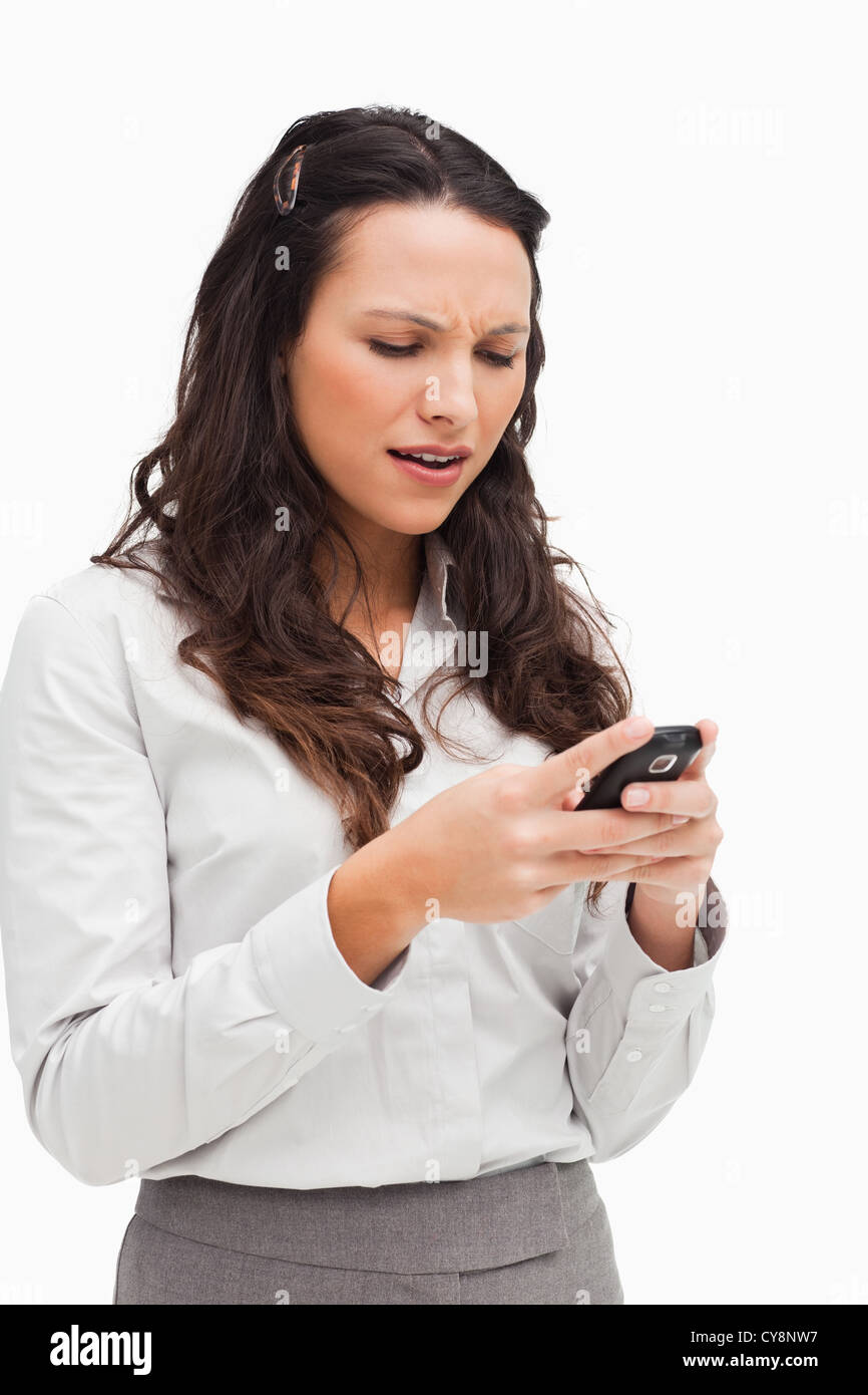 Brunette woman looking her text message Stock Photo - Alamy