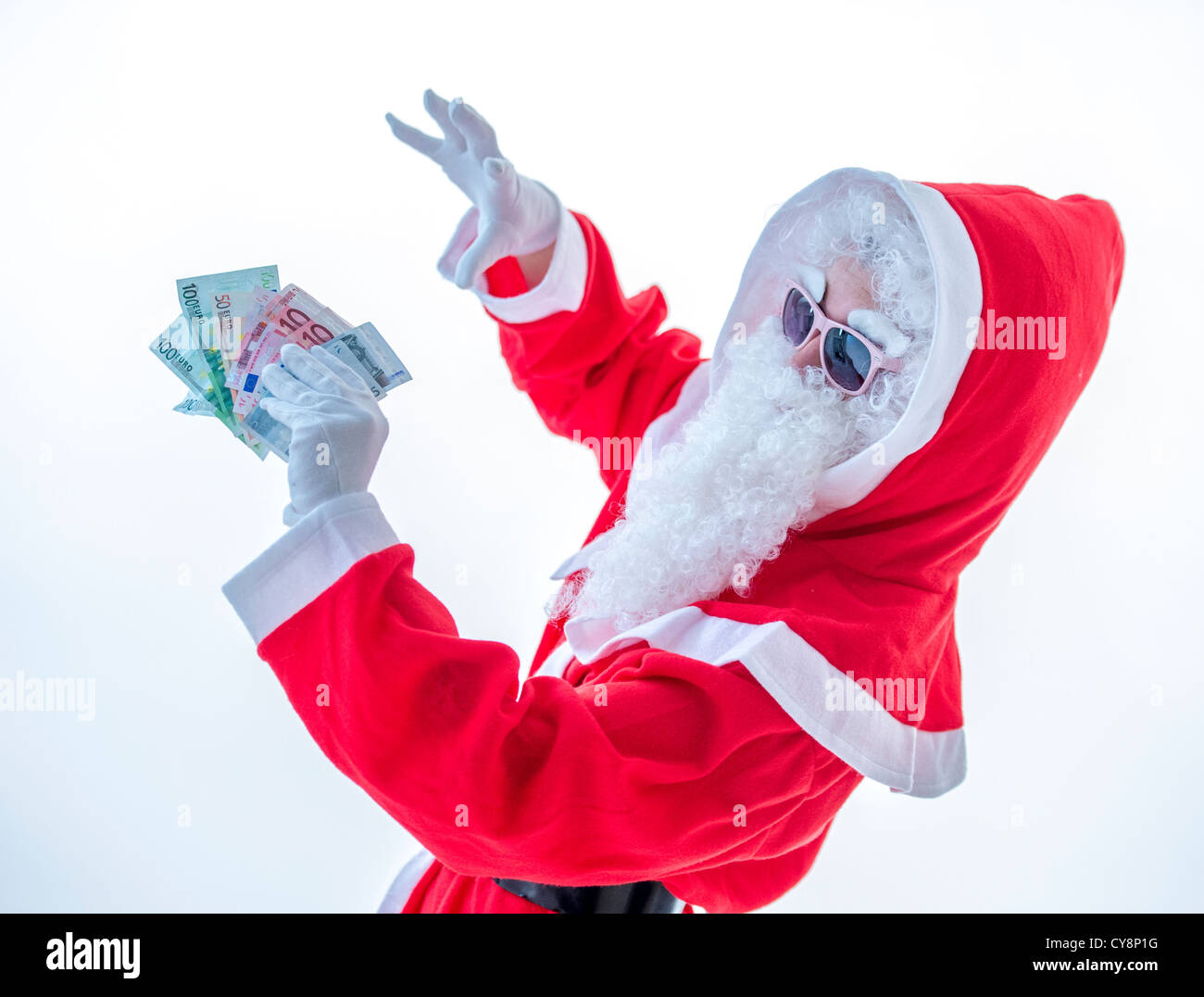 Cool Santa Claus with pink sunglasses posing with Euro bills isolated ...
