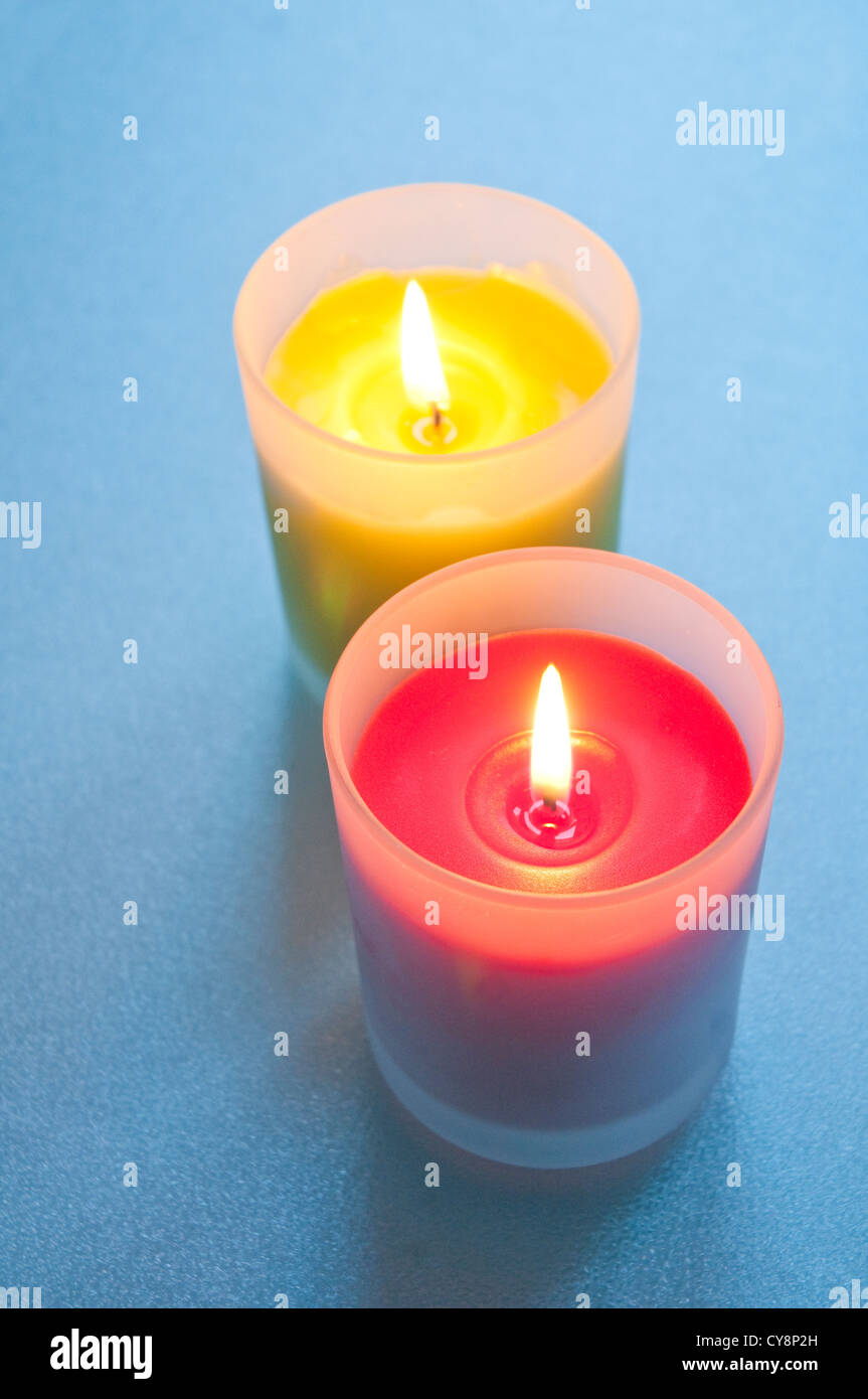 Two lit up candles Stock Photo - Alamy