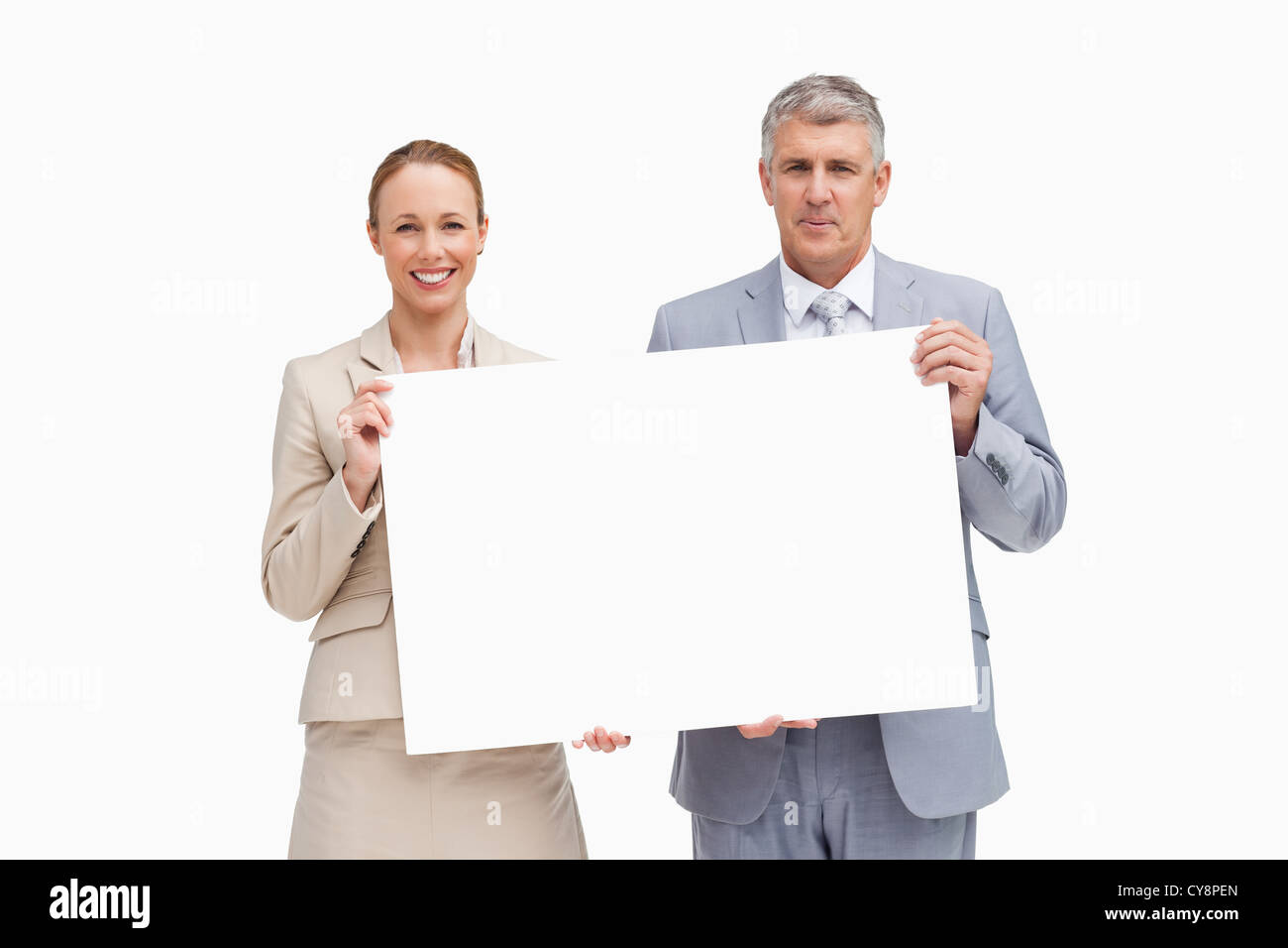 Business people holding a poster Stock Photo - Alamy
