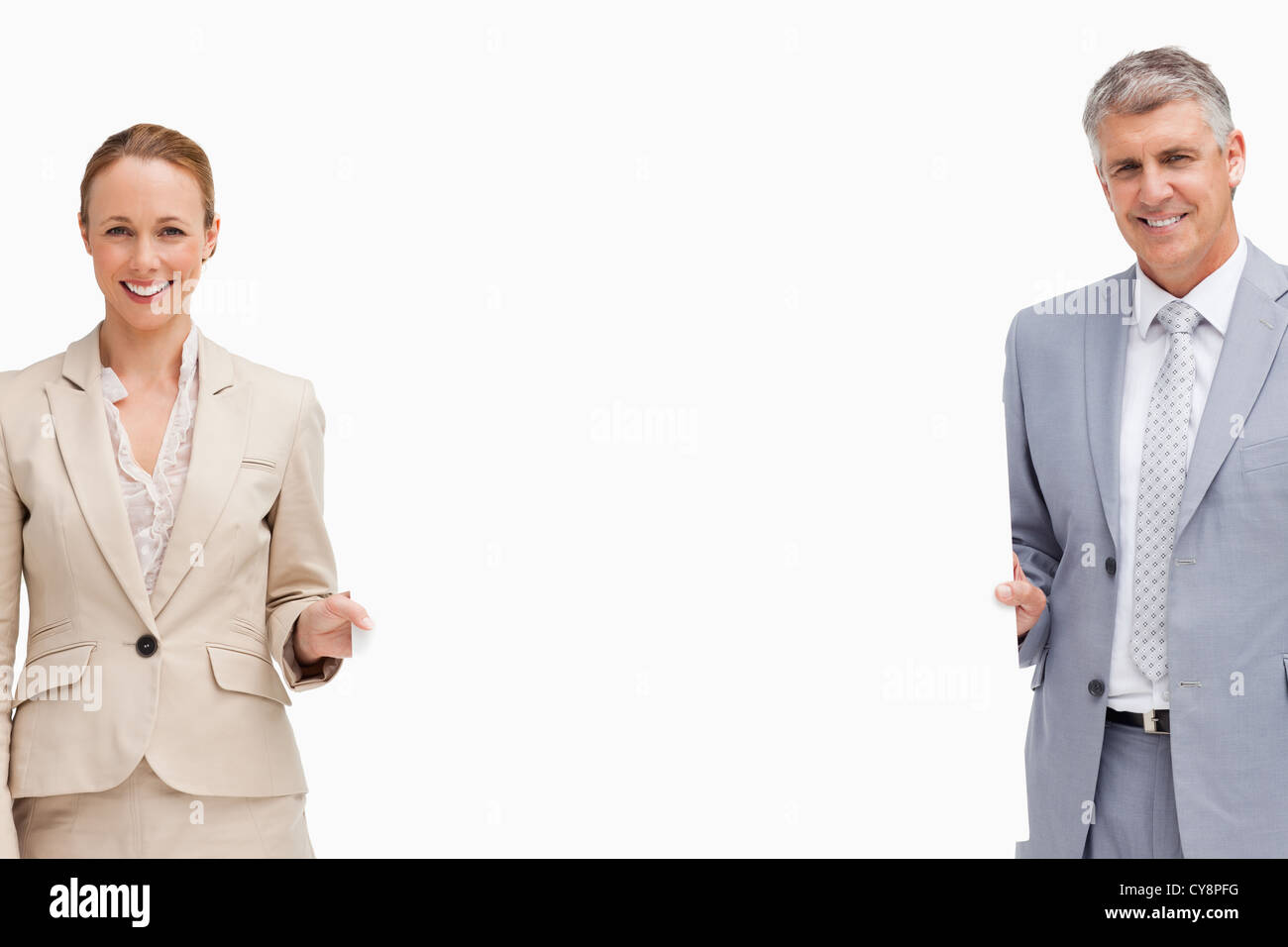Happy business people holding a poster Stock Photo - Alamy
