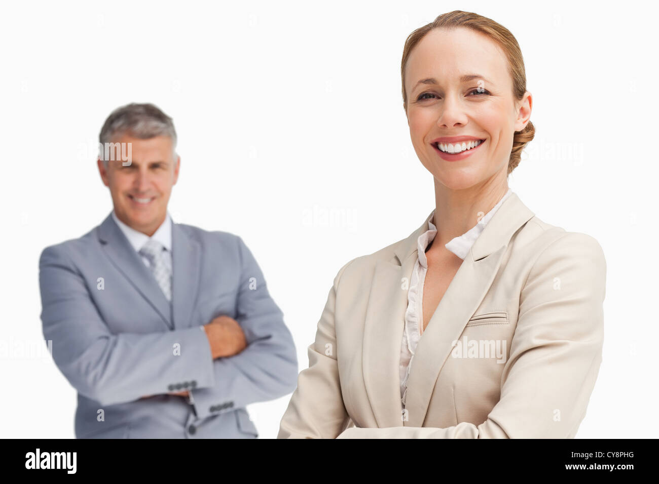Happy business people with folded arms Stock Photo - Alamy