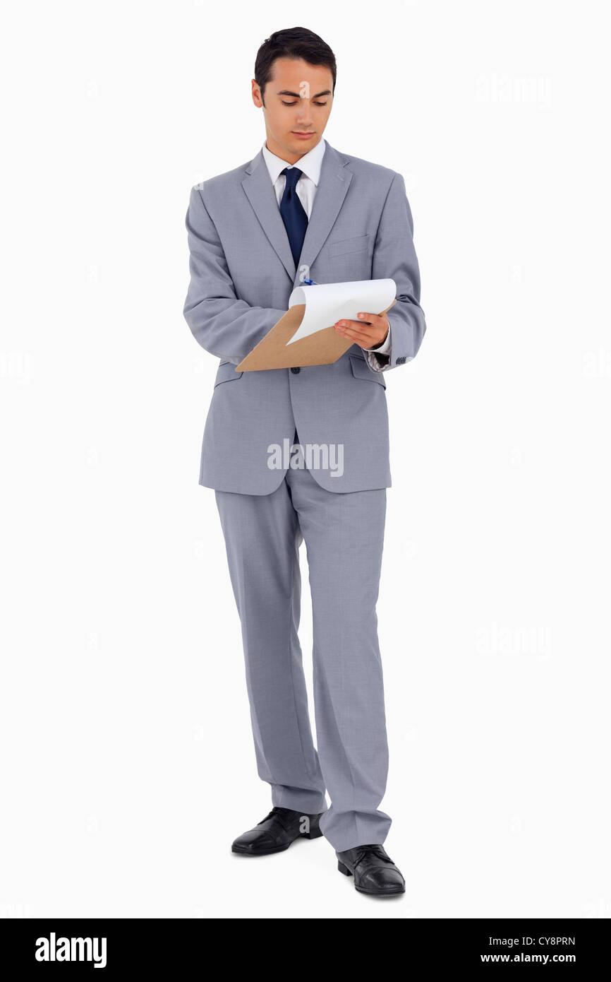Man looking at a file Stock Photo - Alamy