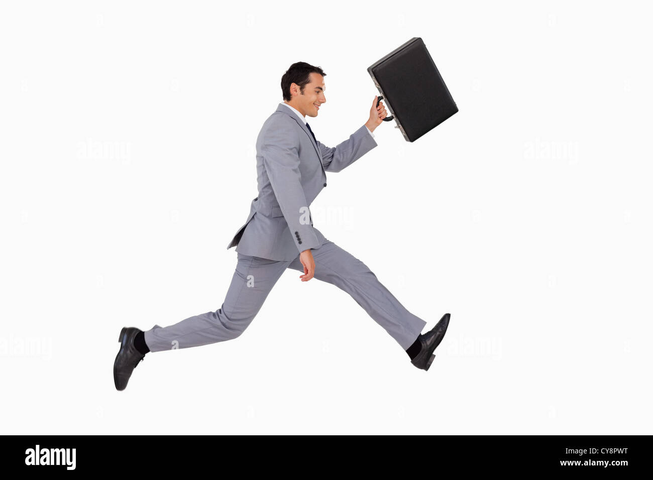 Businessman running with a suitcase Stock Photo - Alamy