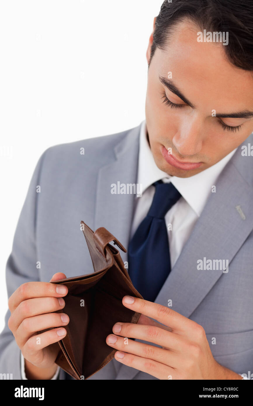 Man in a suit showing his empty wallet Stock Photo - Alamy