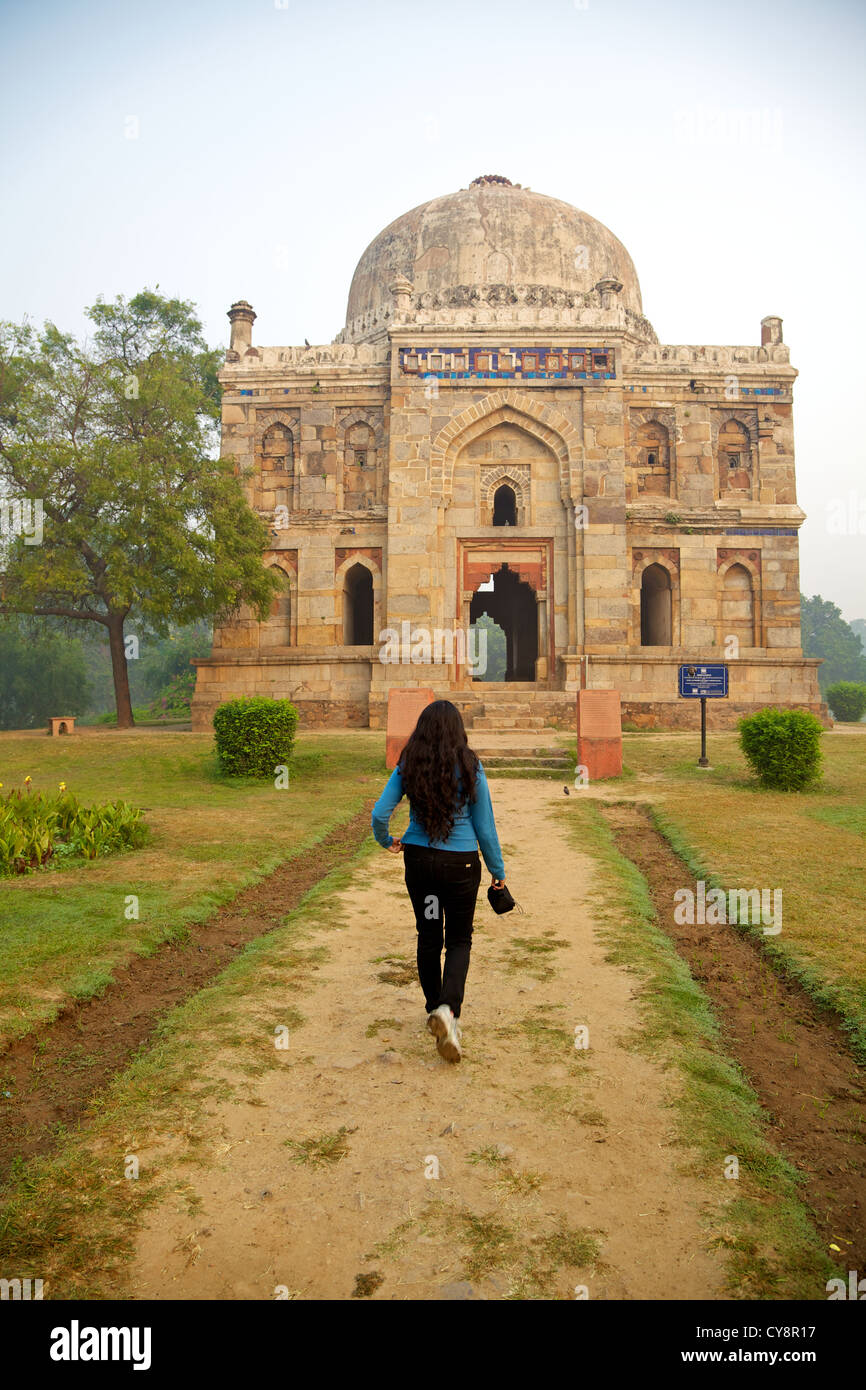A lady walks down the path at Shish Gumbad in Lodhi Garden in Delhi ...