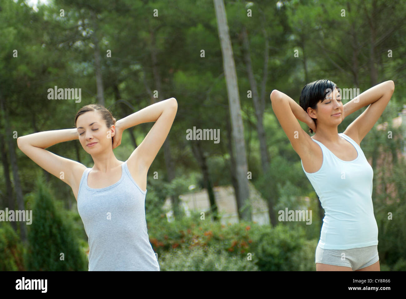Young women exercising outdoors Stock Photo - Alamy