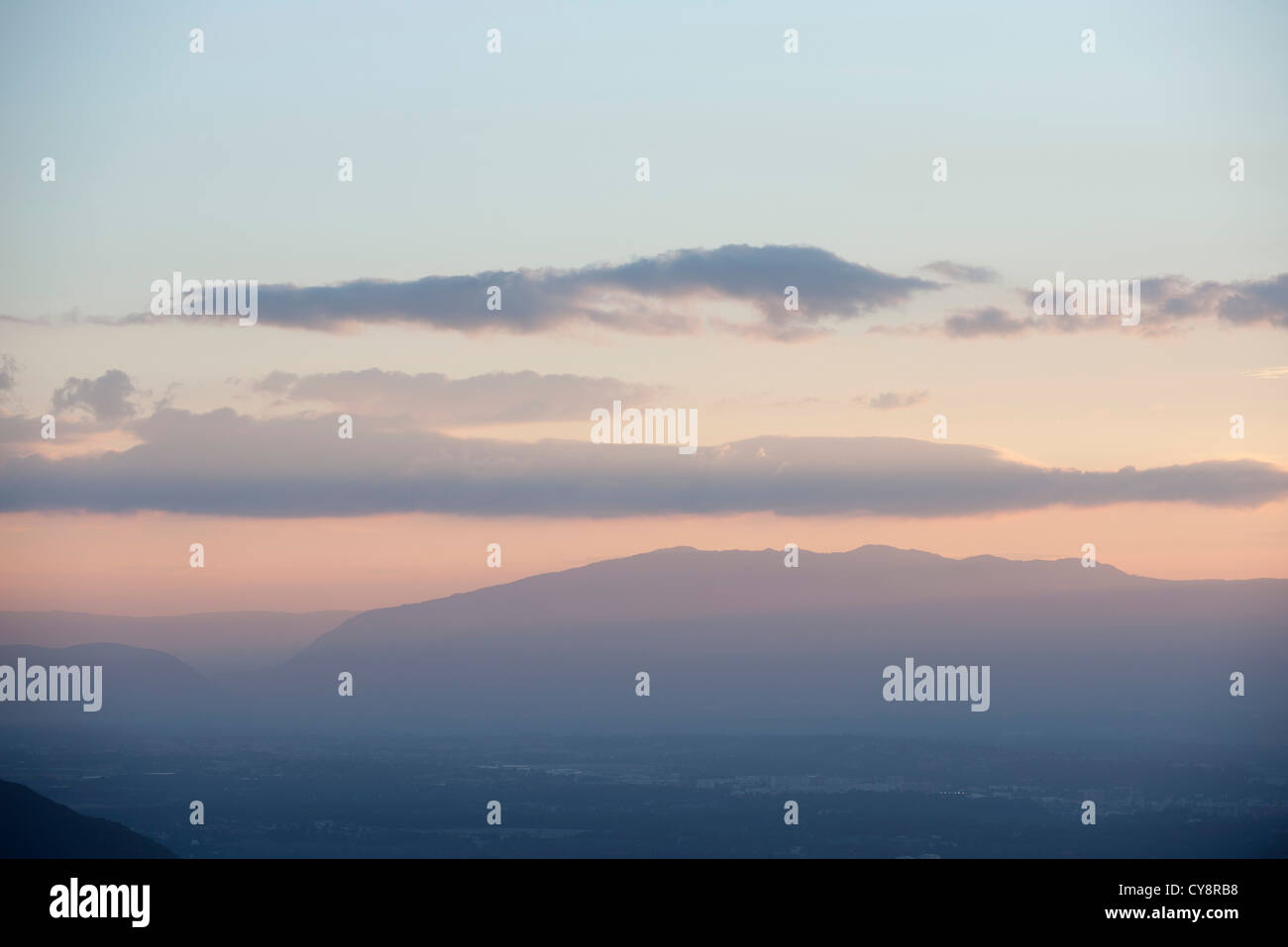 Sun rising over valley Stock Photo - Alamy