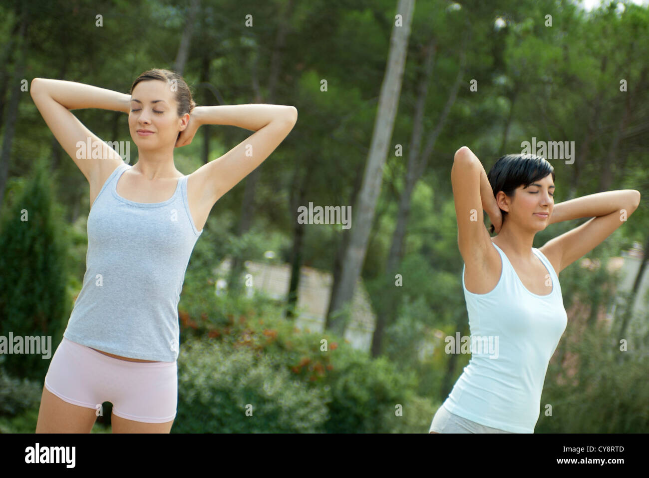 Young women exercising outdoors Stock Photo - Alamy