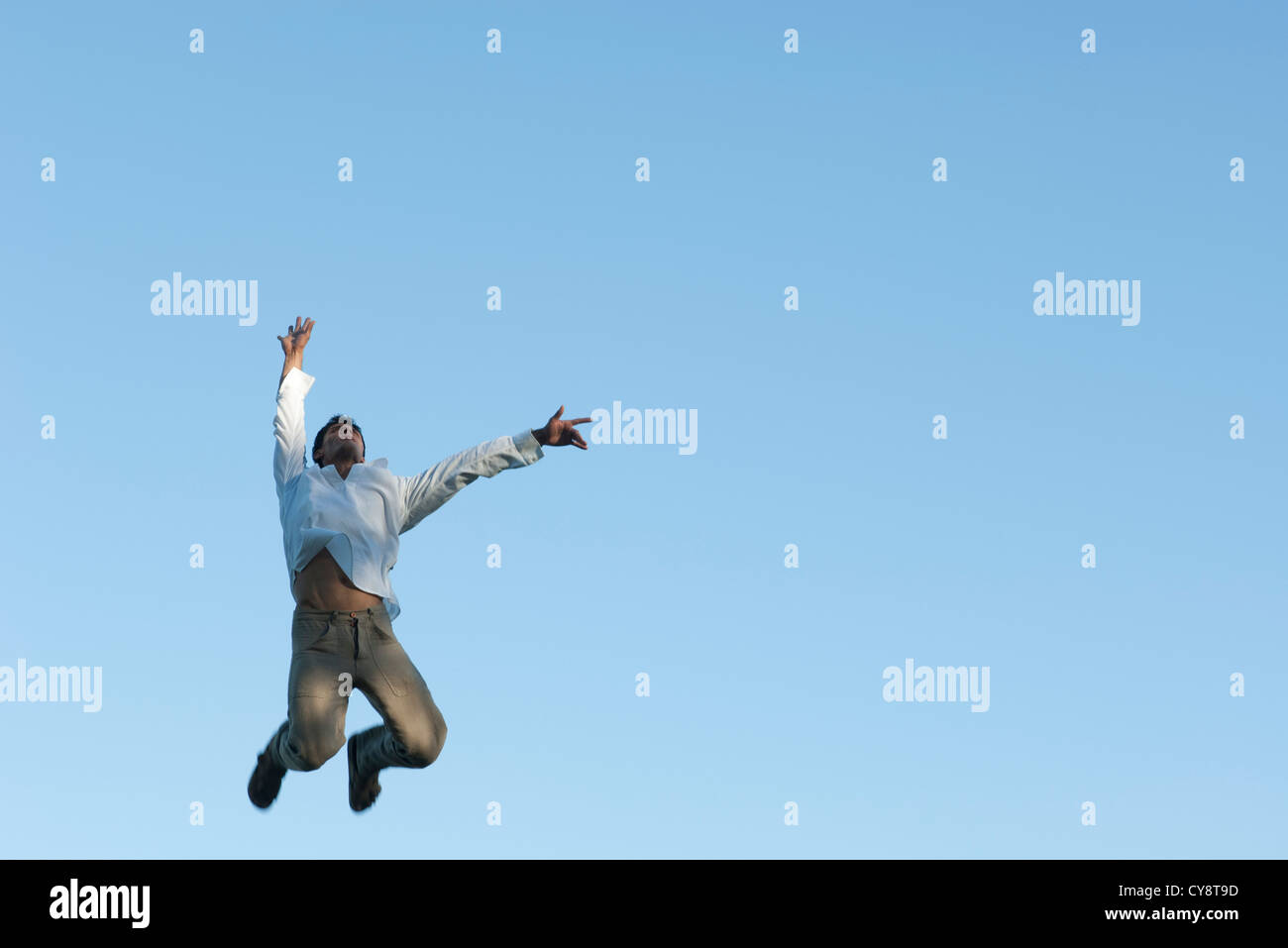 Man jumping in air Stock Photo - Alamy