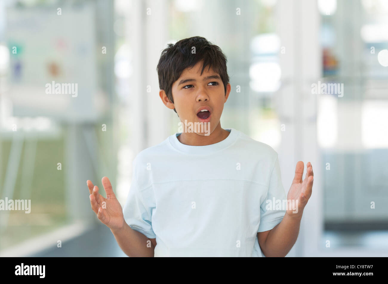 Boy with shocked expression on face Stock Photo - Alamy