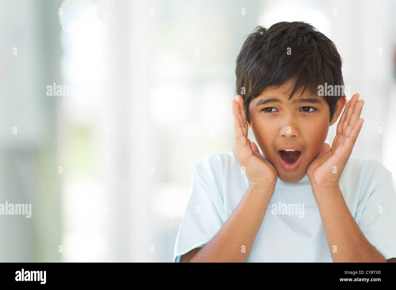 Boy with shocked expression on face Stock Photo - Alamy