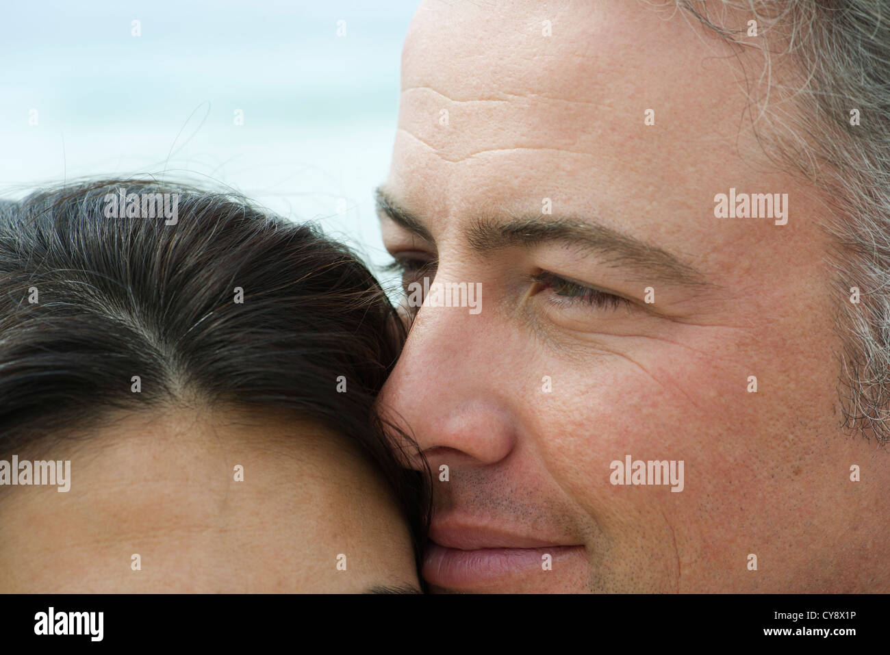 Man nuzzling woman, cropped Stock Photo - Alamy