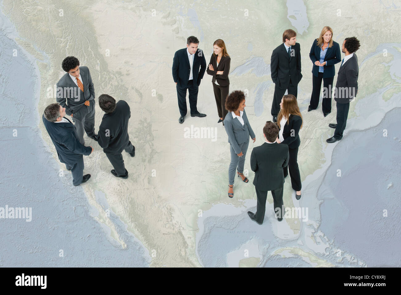 Executives chatting while standing on map of the United States Stock ...