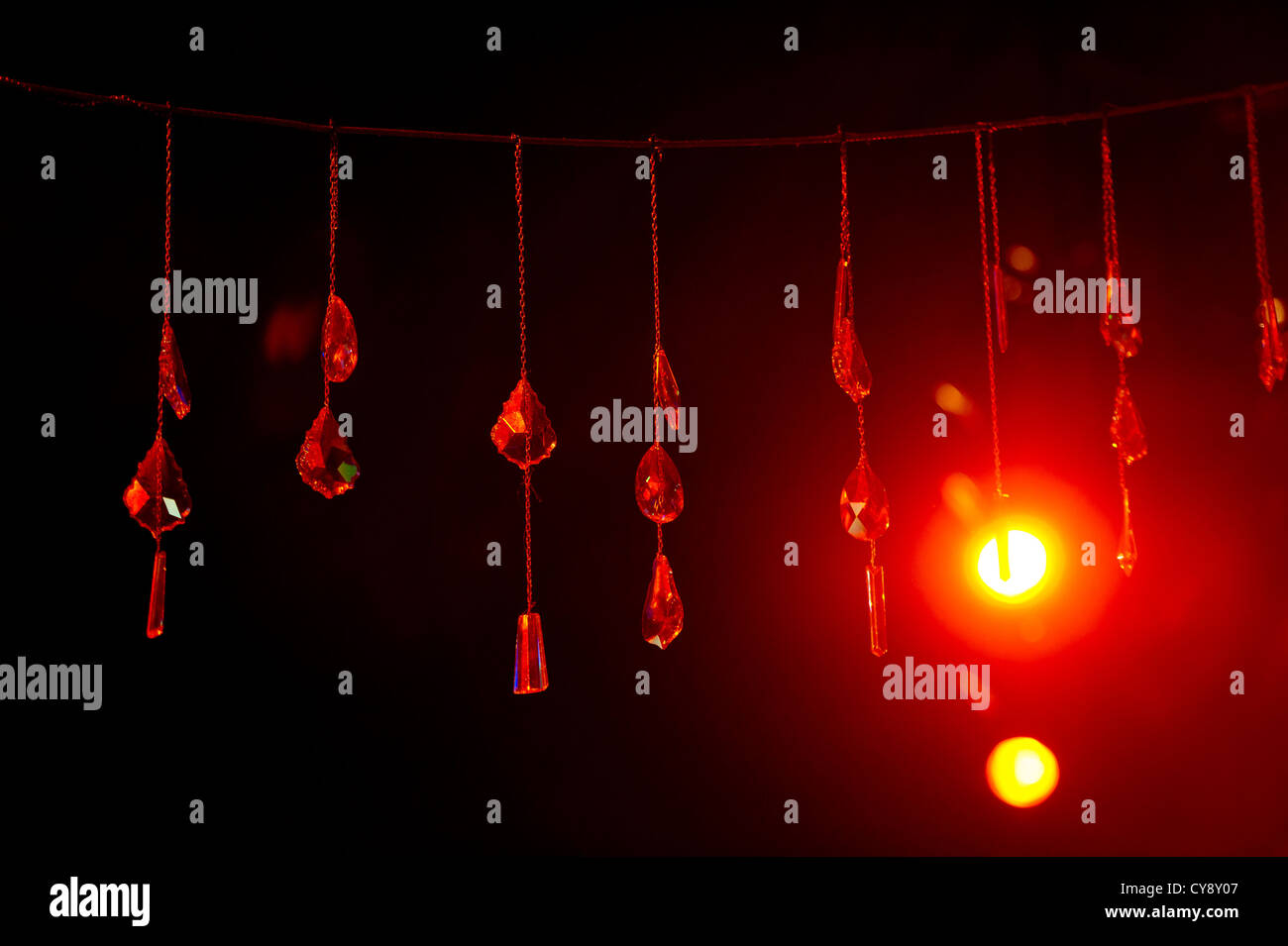 Crystal prisms sparkling in reddish light Stock Photo - Alamy