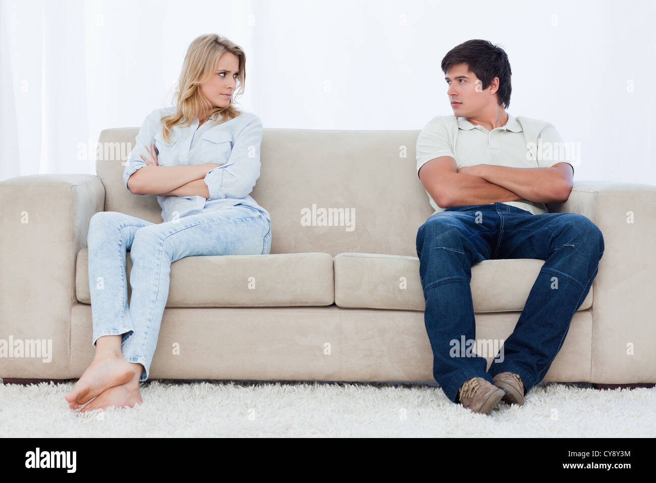 Man woman sitting opposite ends hi-res stock photography and images - Alamy