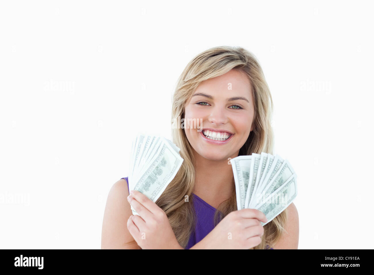 Happy blonde woman holding dollar notes Stock Photo - Alamy