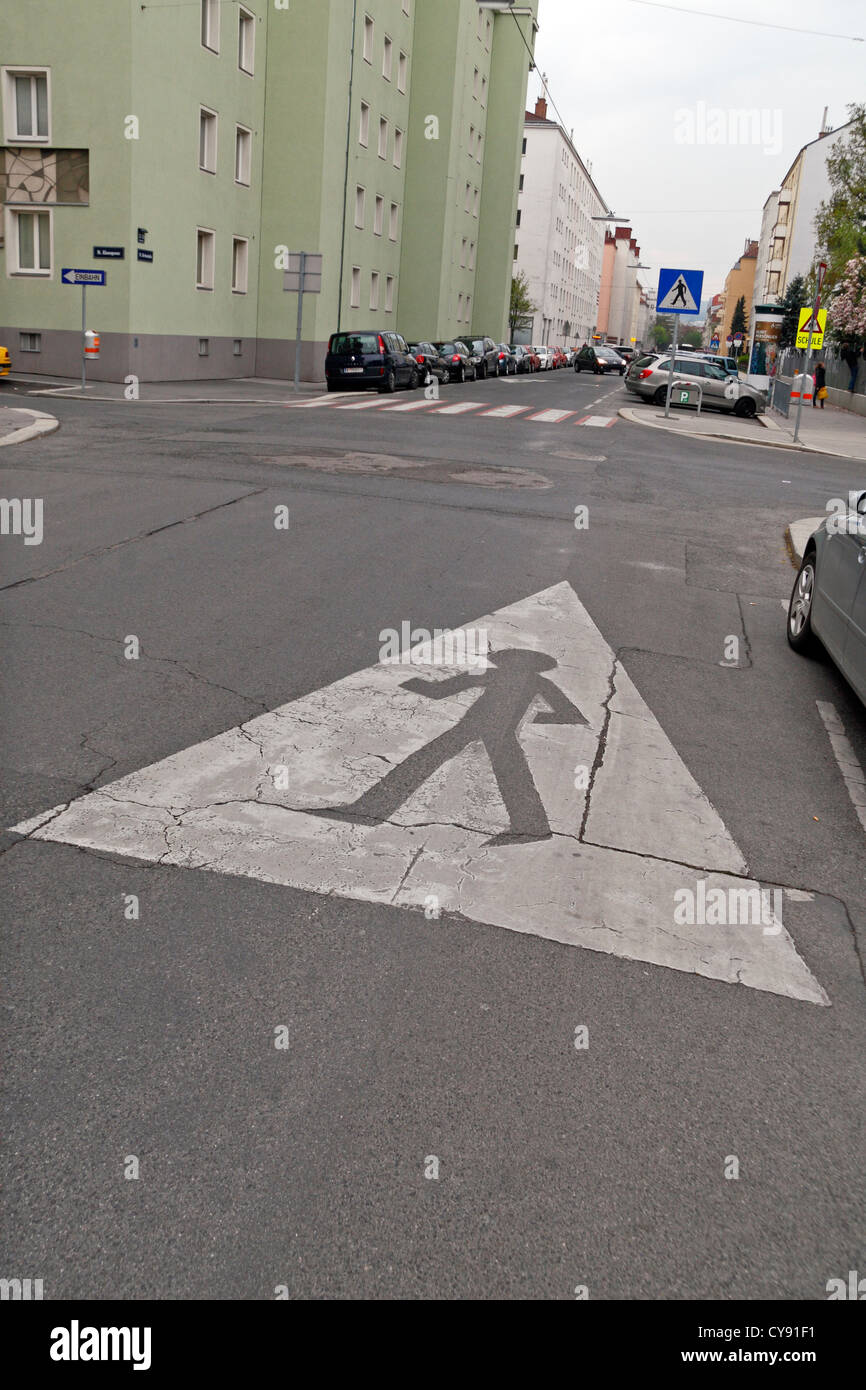 A large pedestrian warning sign on a road in Vienna, Austria Stock ...