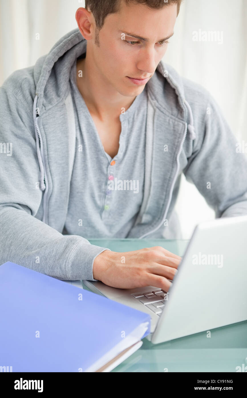 Close-up of a student using a laptop Stock Photo - Alamy
