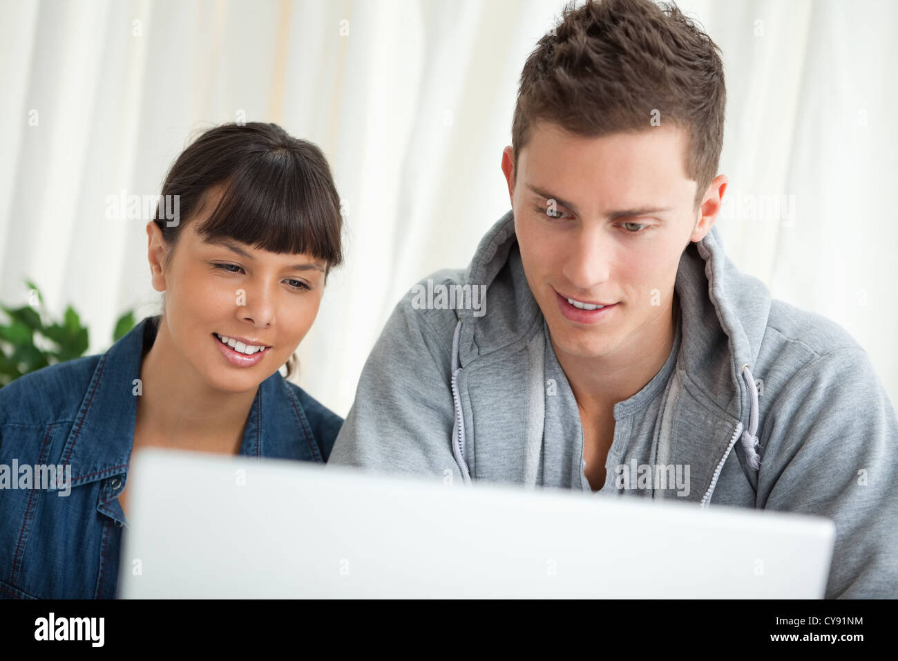 Students using a laptop Stock Photo - Alamy