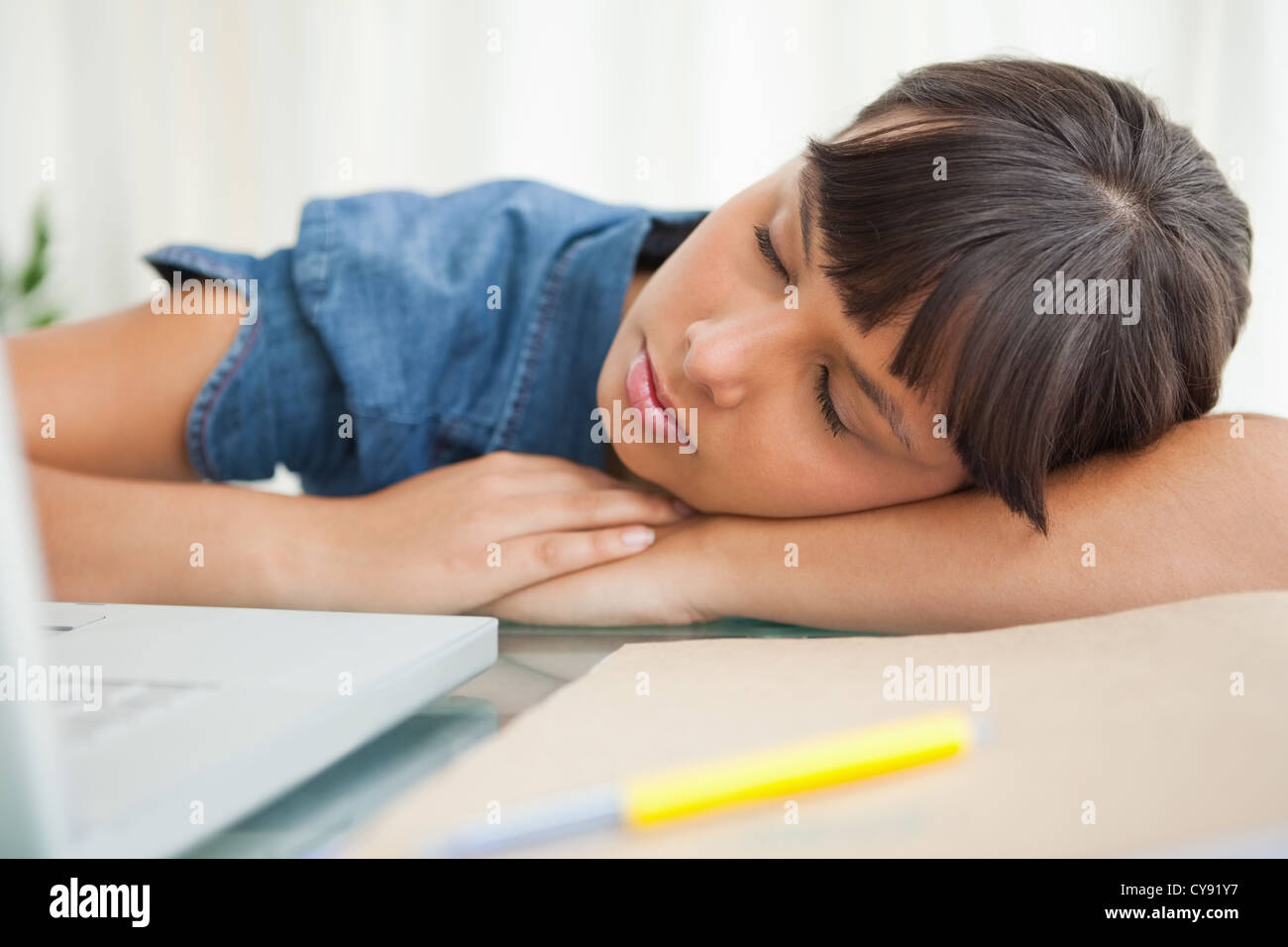 Female student sleeping on her desk Stock Photo - Alamy