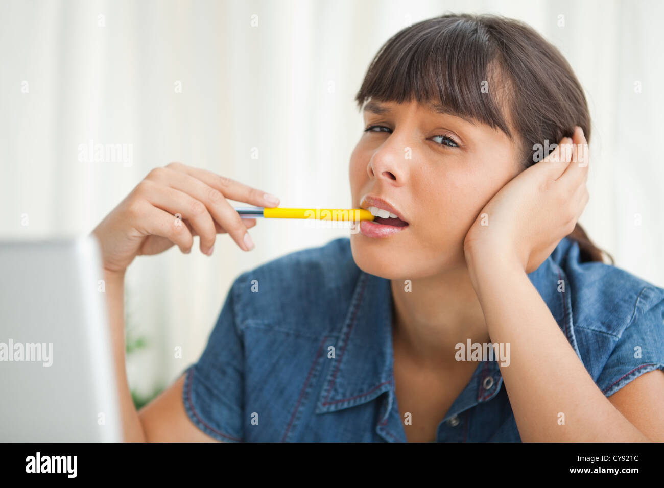 Portrait of a student scratching her head for this homework Stock Photo ...