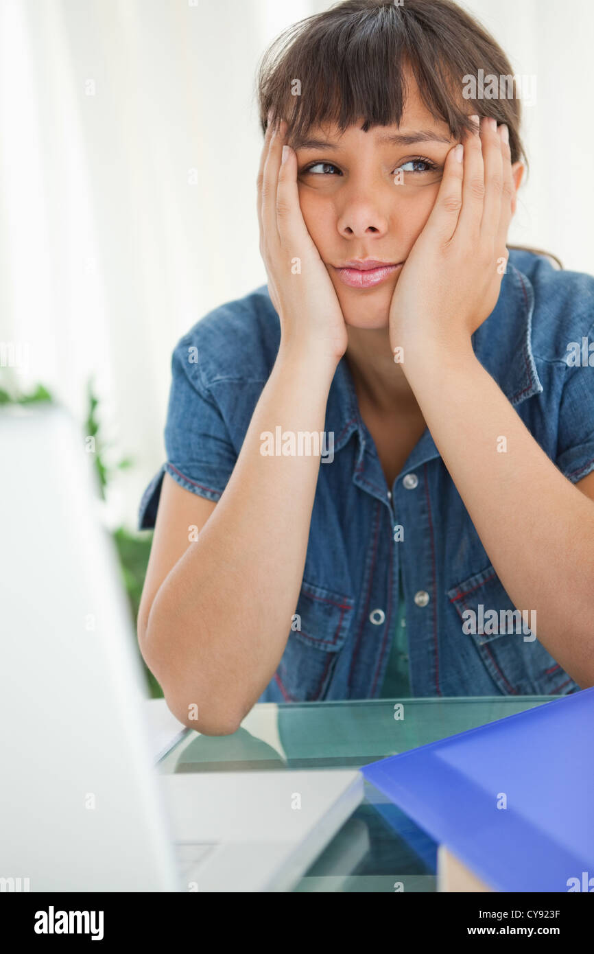 Female student bored looking up Stock Photo - Alamy