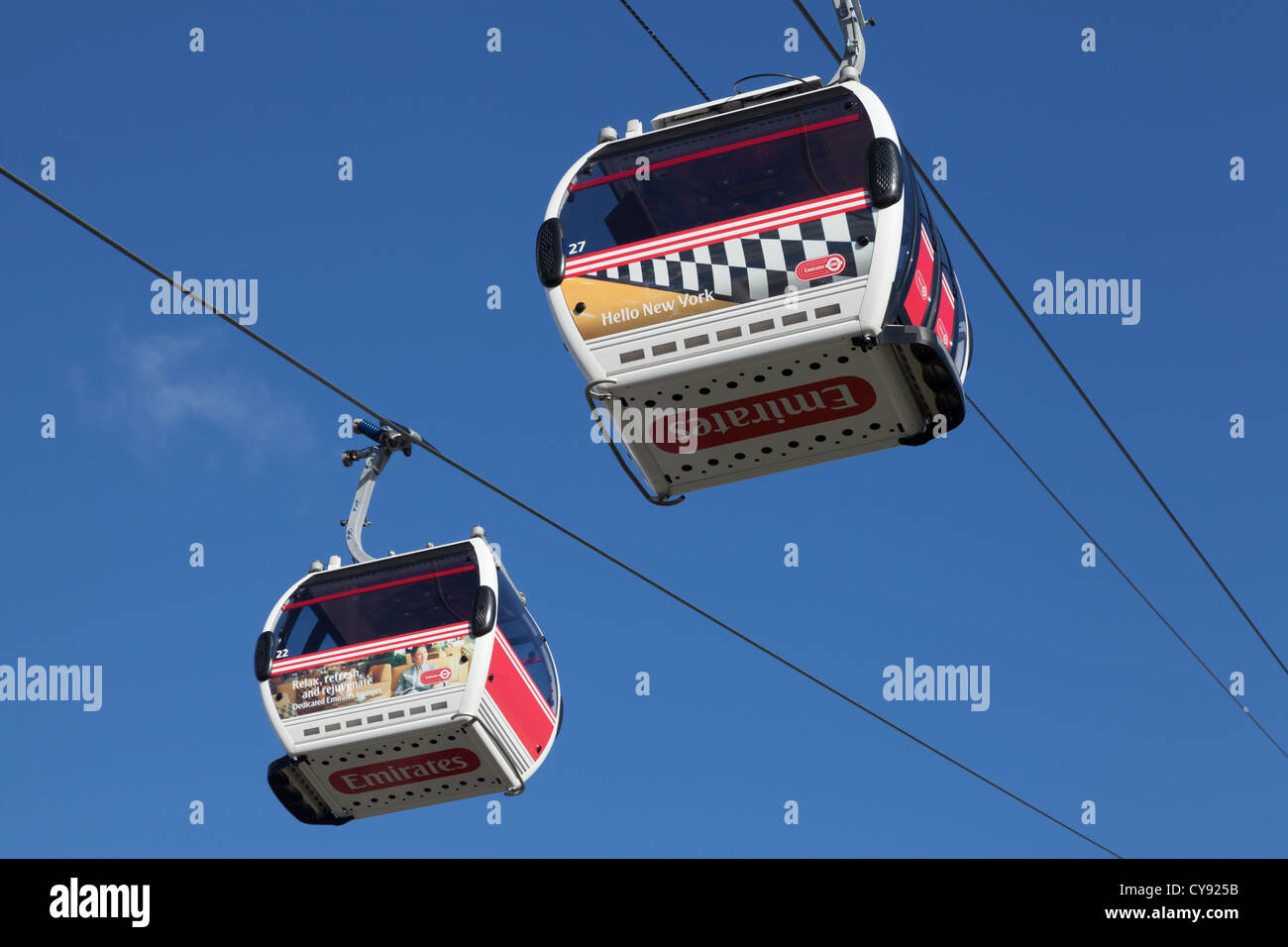 Two Emirates Air Line cable cars in sky above River Thames, Greenwich ...