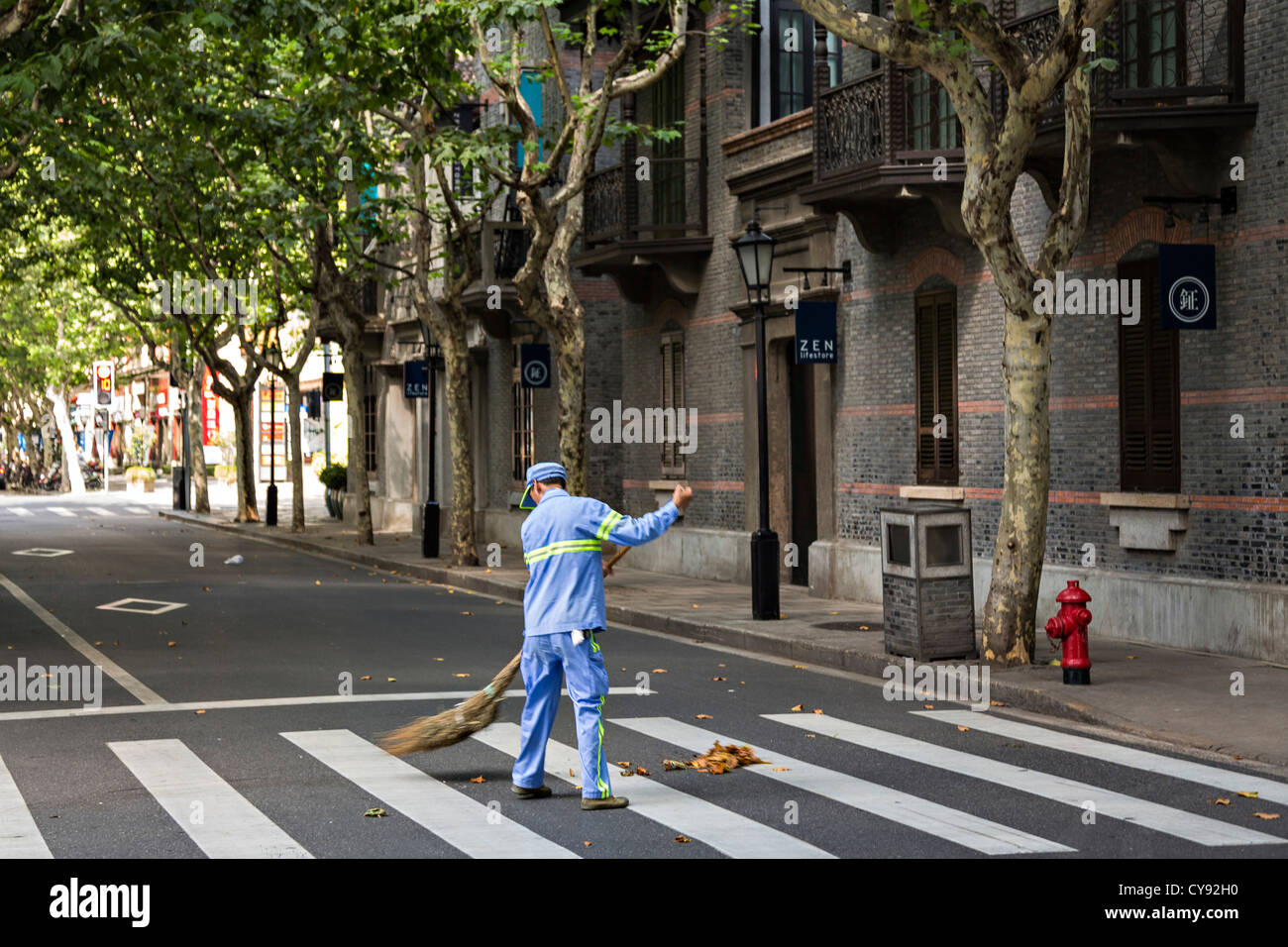 A street sweeper cleans up in Xintiandi Plaza shopping district ...