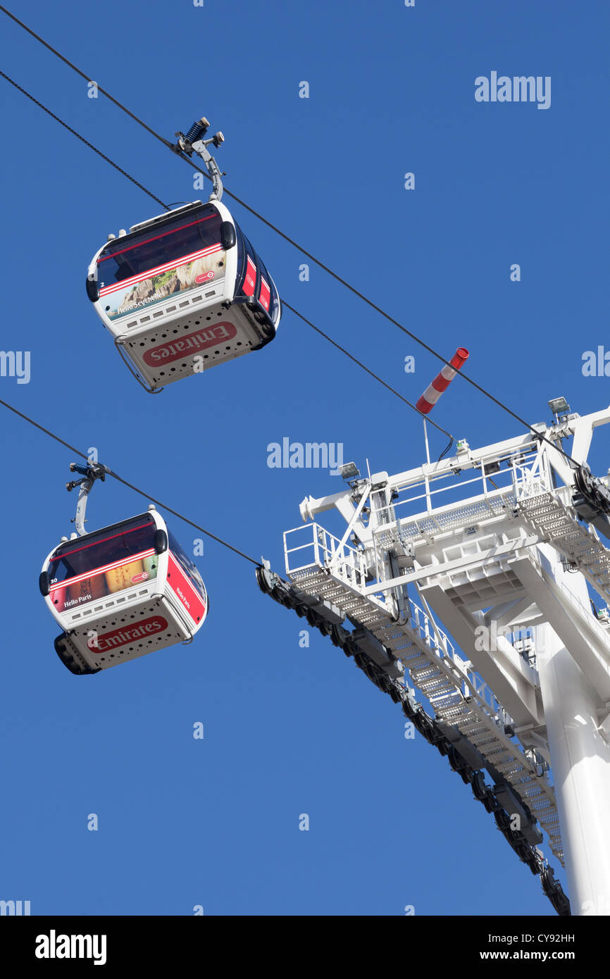 Two Emirates Air Line cable cars in sky above River Thames, Greenwich ...