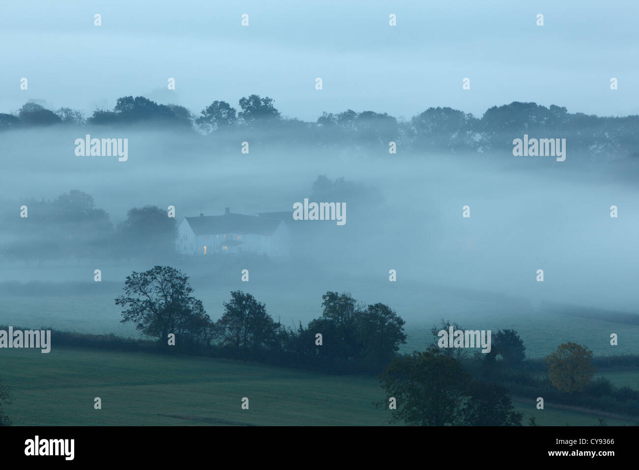 House in mist at dusk. Somerset. England. UK Stock Photo - Alamy