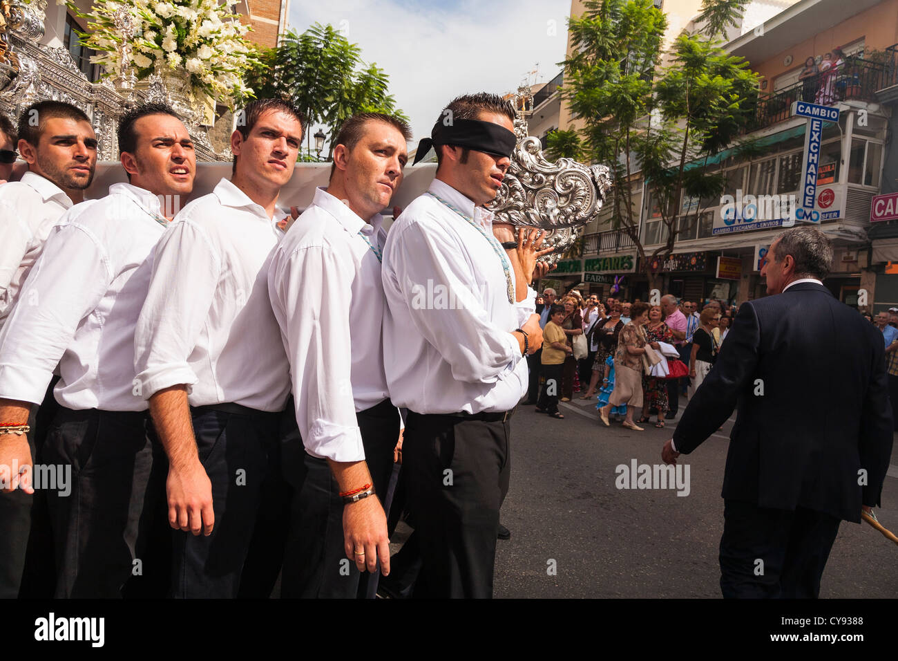 Young men carry a Religious Icon through Fuengirola. Spain. The ...